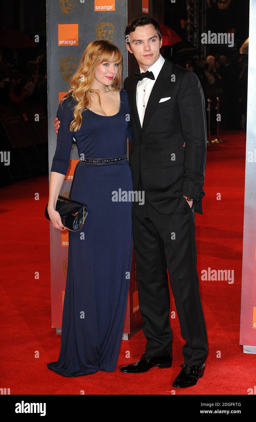Nicholas Hoult and guest arriving at the 2011 Orange British Academy ...