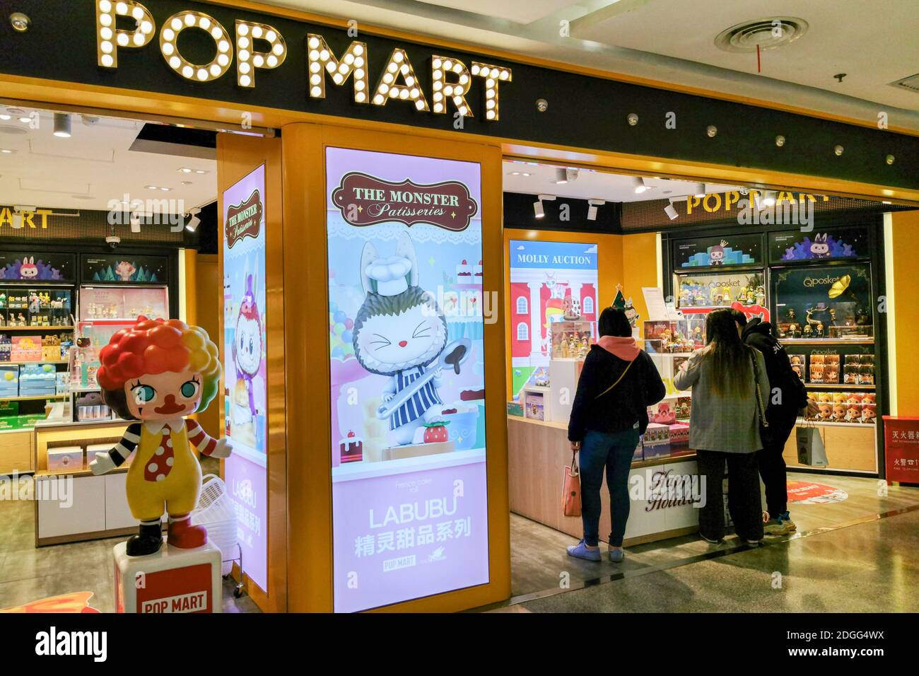 --FILE--Customers wander and select products at a Pop Mart store with ...
