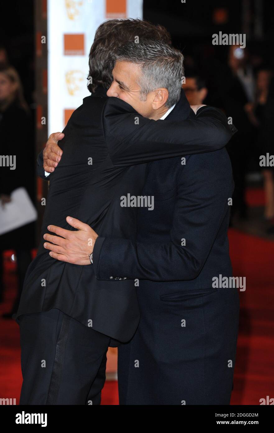 Colin Firth and George Clooney arriving at the Orange British Academy ...