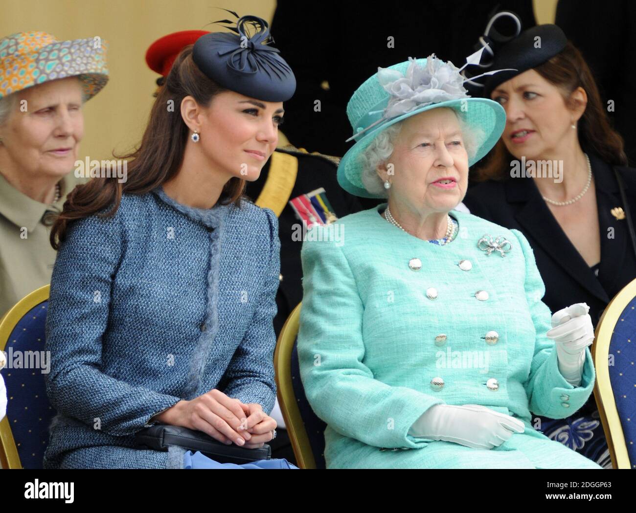 The Duchess of Cambridge and Queen Elizabeth II watch a children's ...