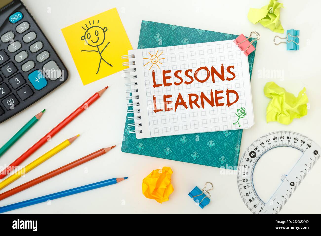 Open notebook with school supplies. Inscription Lessons Learning Stock ...