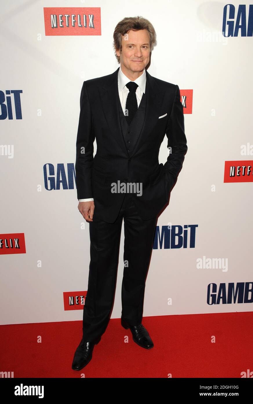Colin Firth arriving on the red carpet at the world premiere of Gambit ...