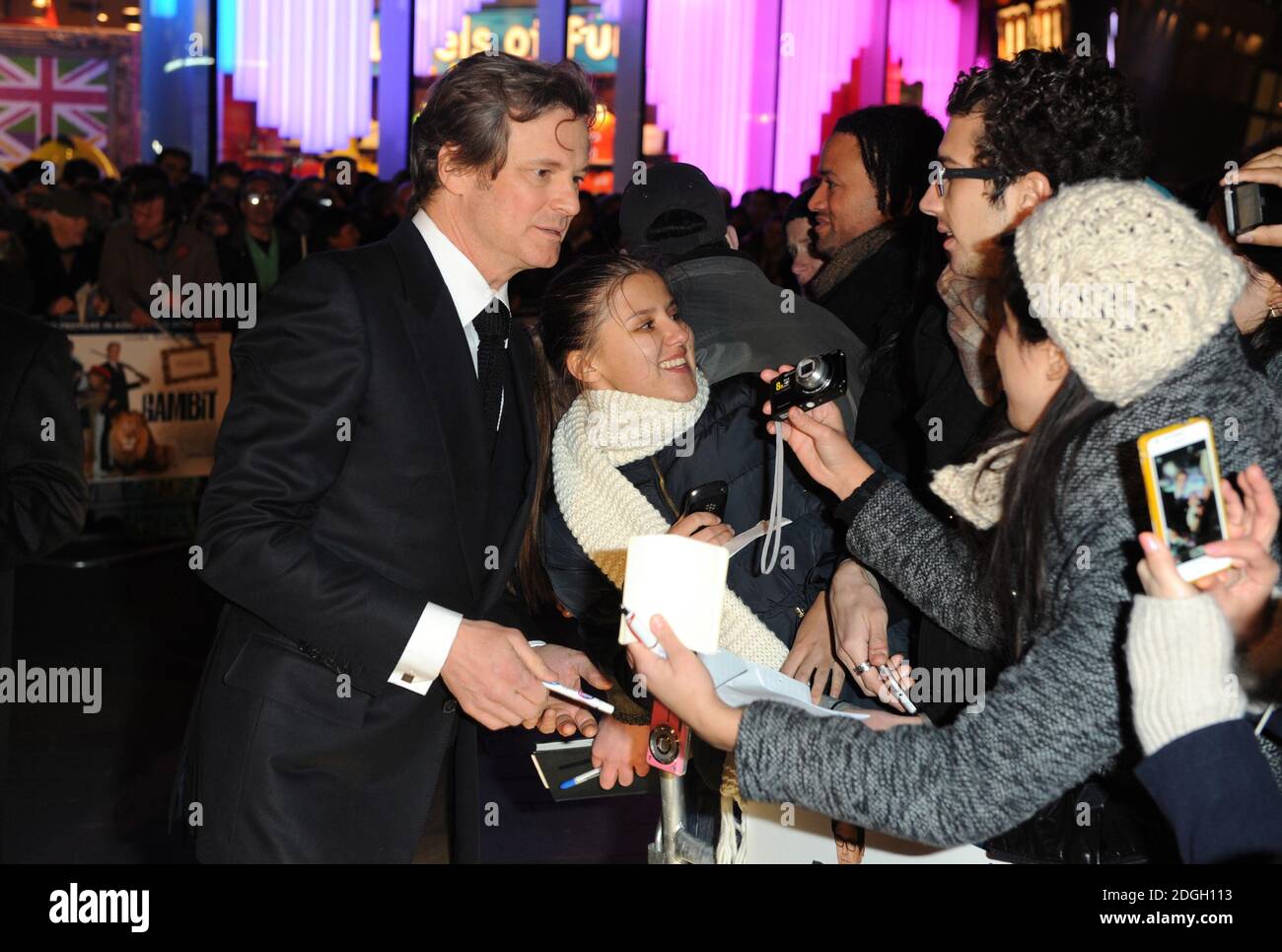 Colin Firth arriving on the red carpet at the world premiere of Gambit ...