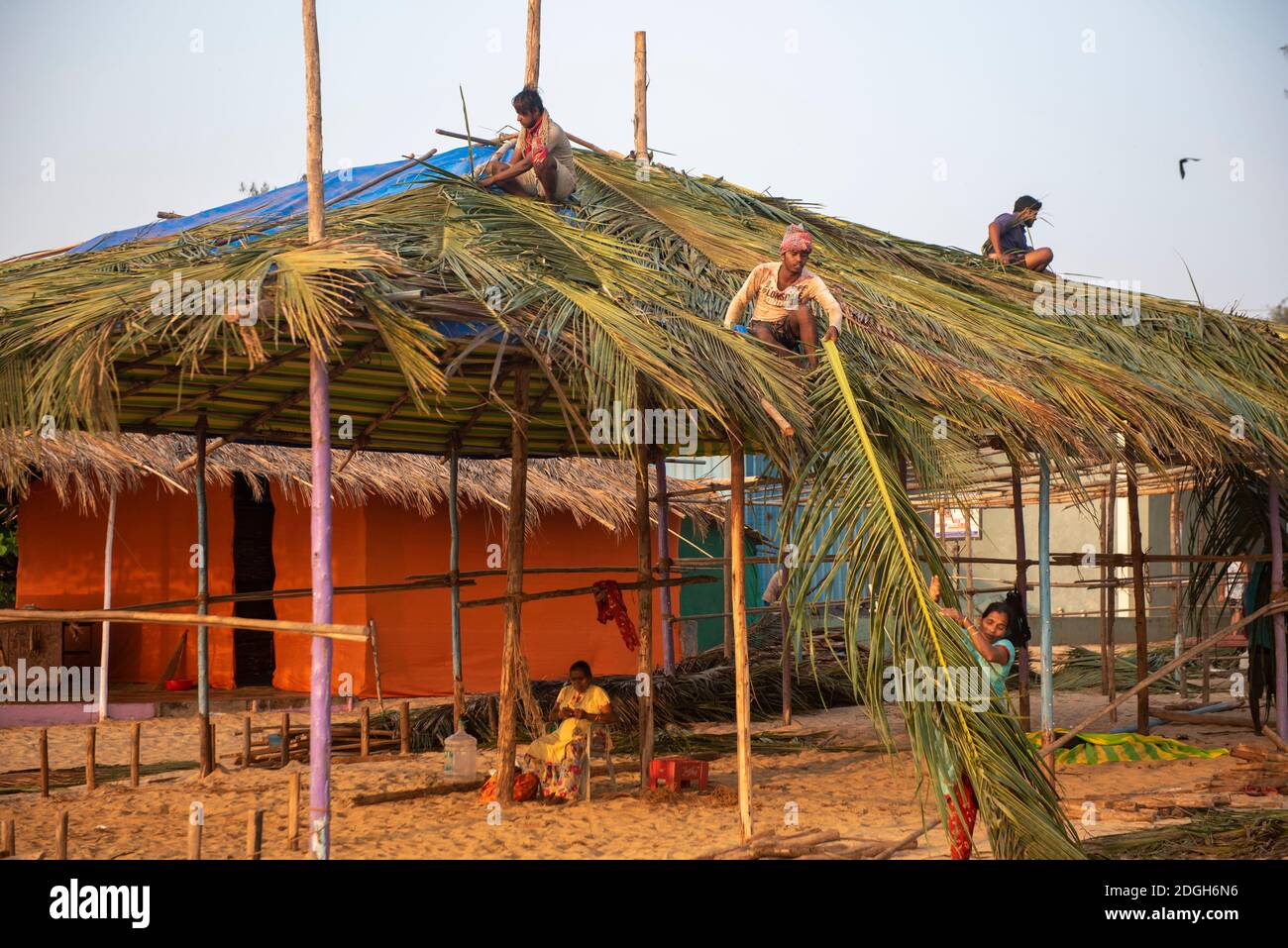 Goa, India -10 November 2020, Indian workers making the top of the roof ...
