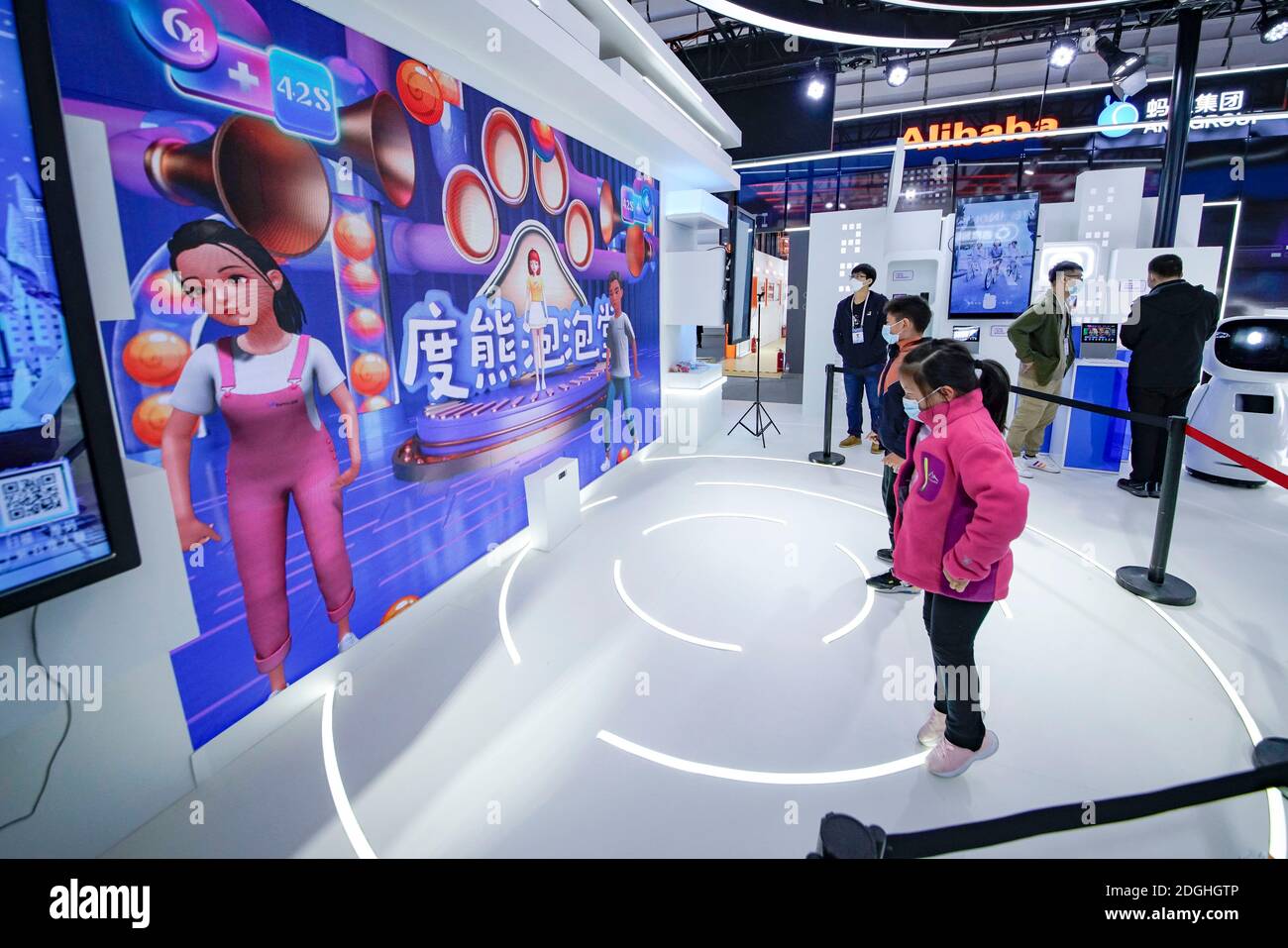 Visitors experience and take photos of the products exhibited at the ...