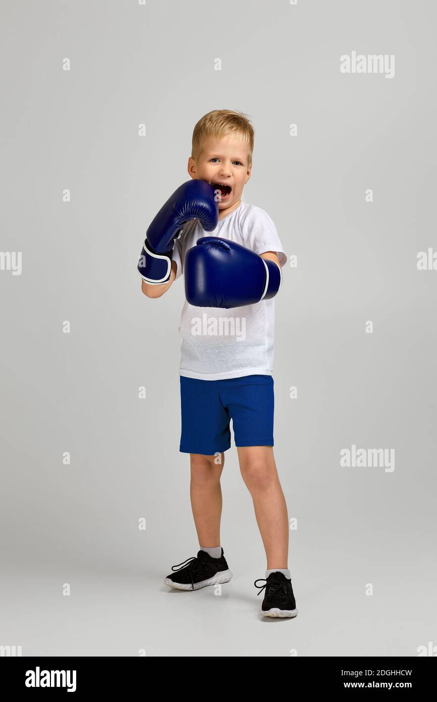 little boxing fighter boy in blue boxer gloves Stock Photo - Alamy