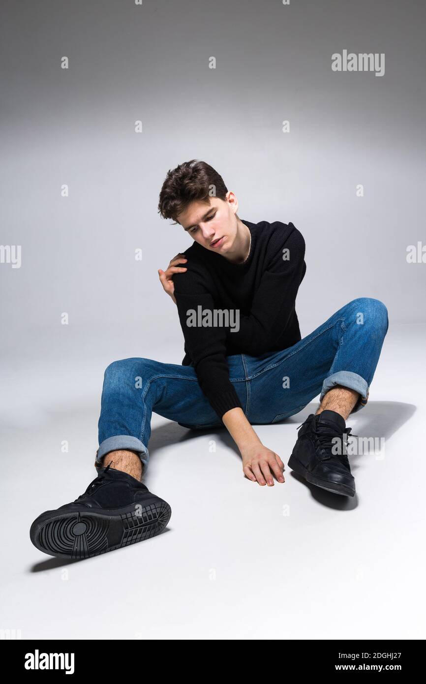 Stylish handsome man posing sitting on floor. Handsome Guy. cool ...