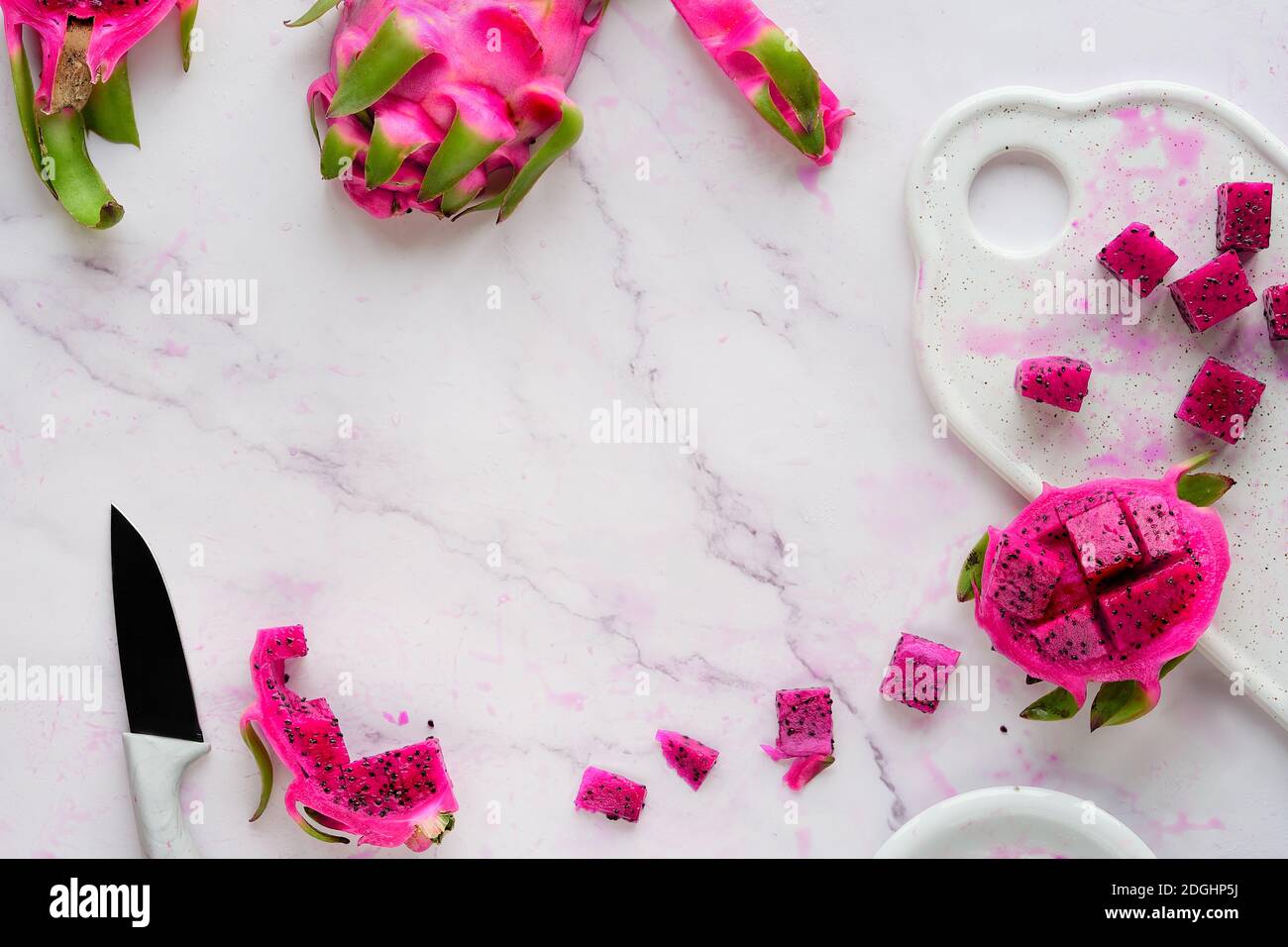 Ugly food. Juicy pink dragon fruit, pitaya, pitahaya sliced on marble ...