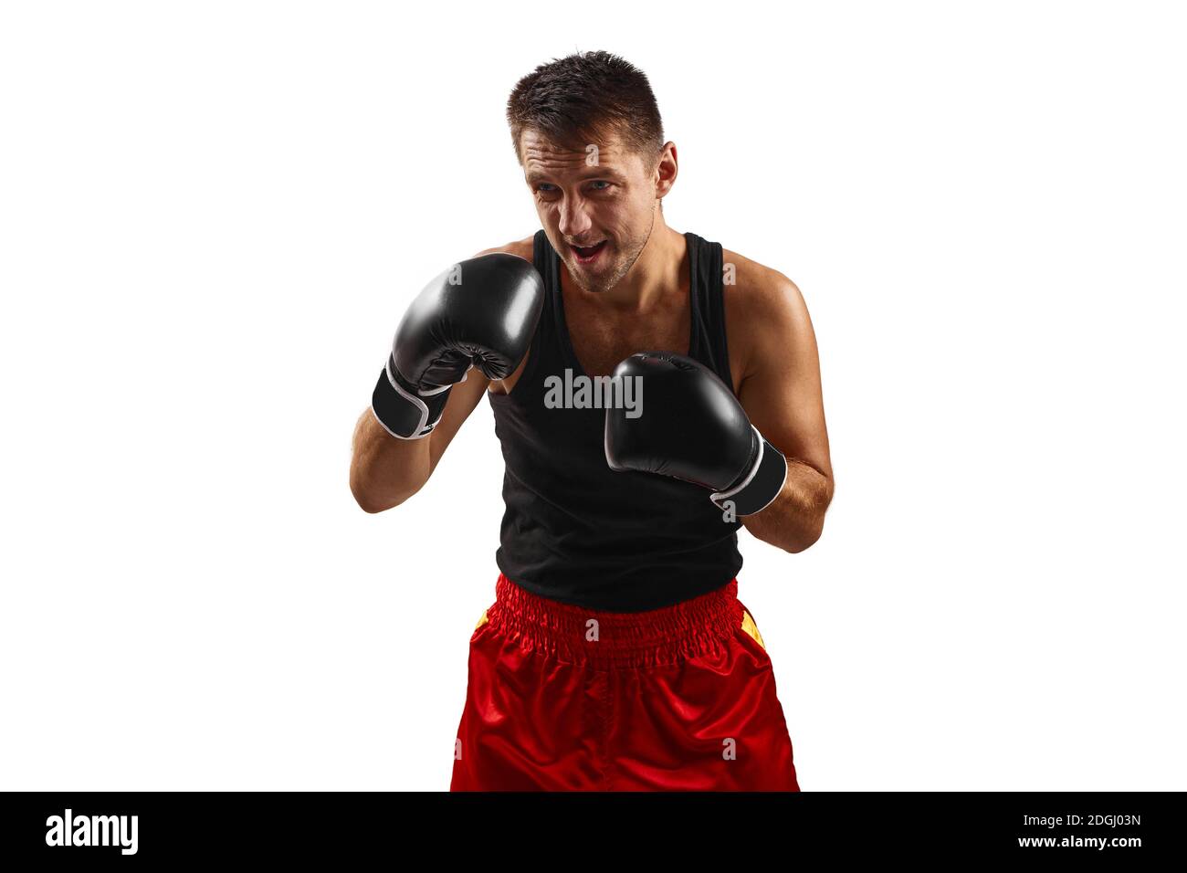 Aggressive boxer in black boxing gloves punching isolated on white ...