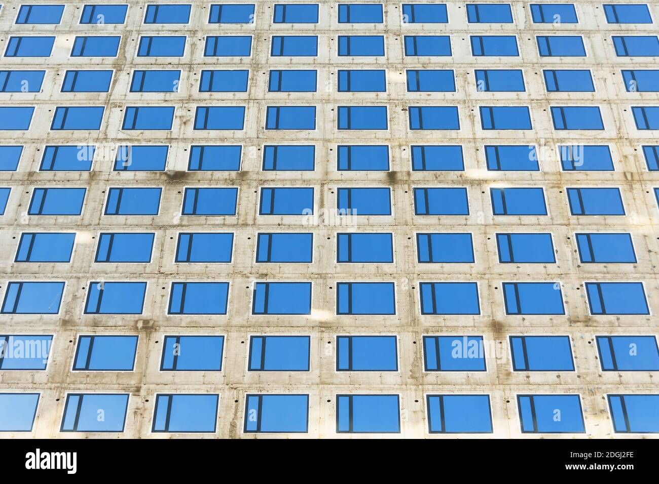 View of a new building made of concrete monolith, new inserted window ...