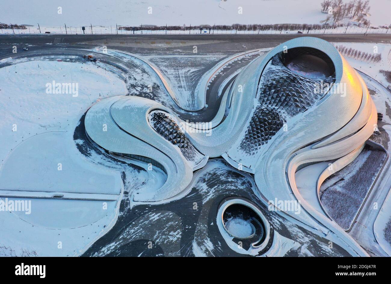 Aerial view of Harbin Opera House covered in snow, which is spectacular ...