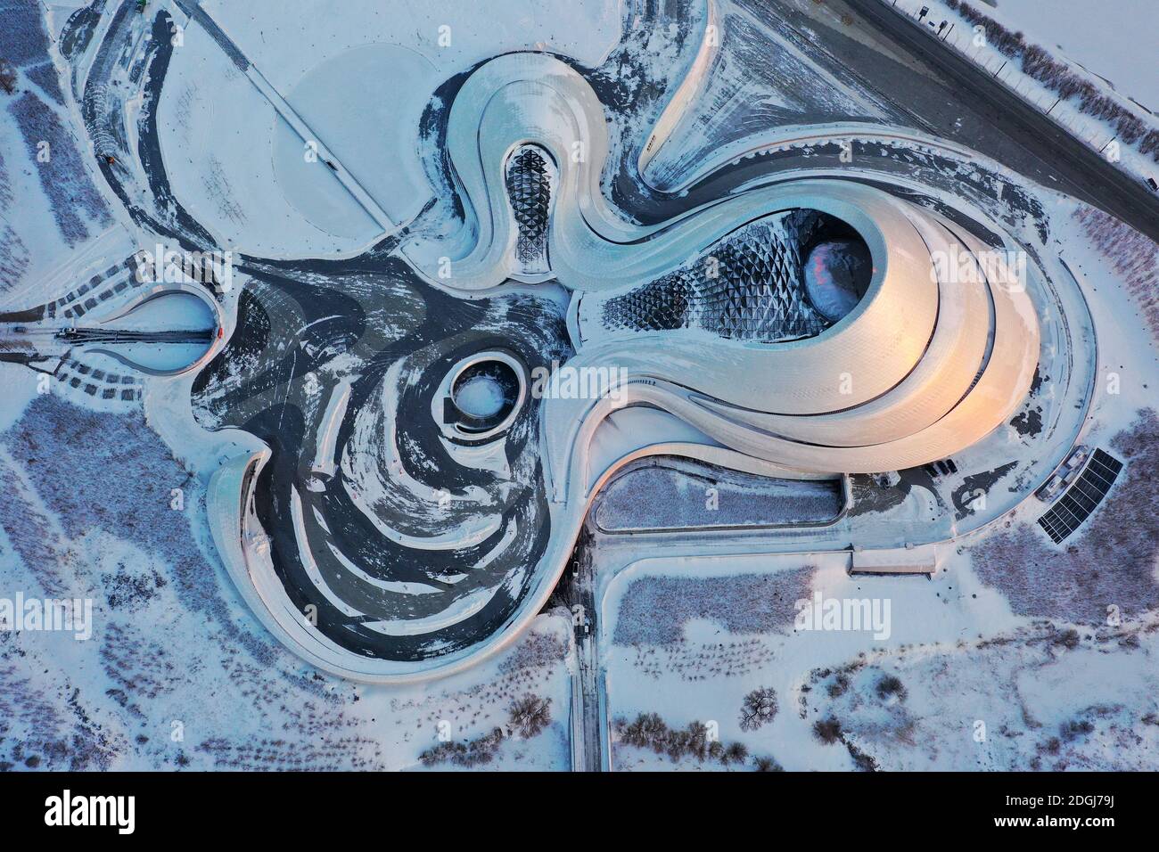 Aerial view of Harbin Opera House covered in snow, which is spectacular ...