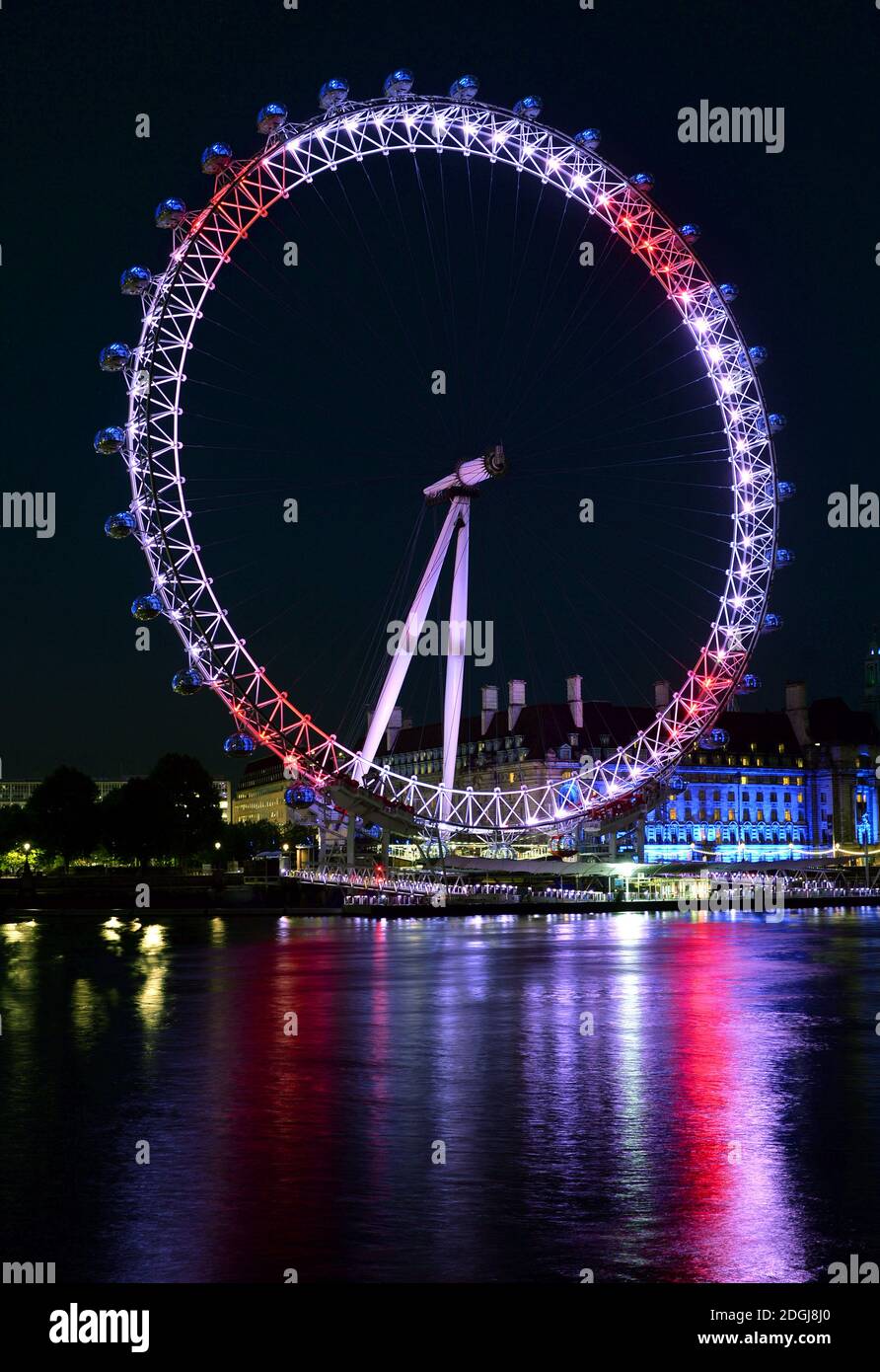 The EDF London Eye as the wheel lights turn red and white to mimic the ...