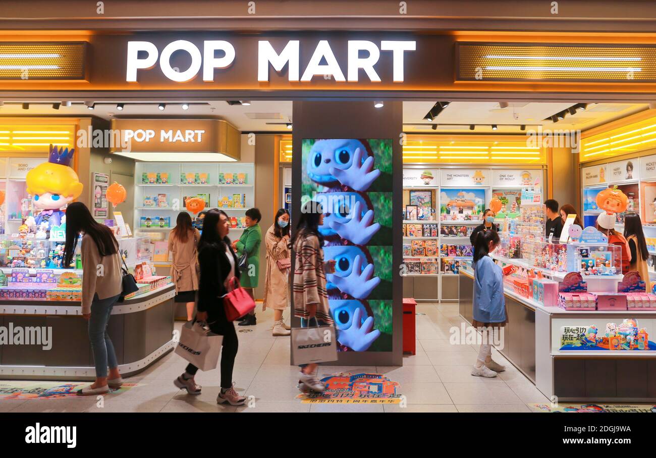 --FILE--Customers wander and select products at a Pop Mart store with ...
