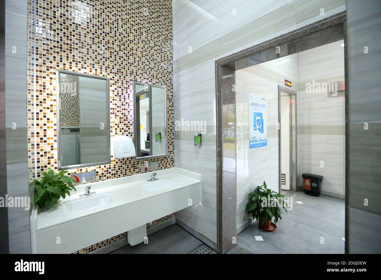 An automatic warning device is installed in a public toilet, if the ...
