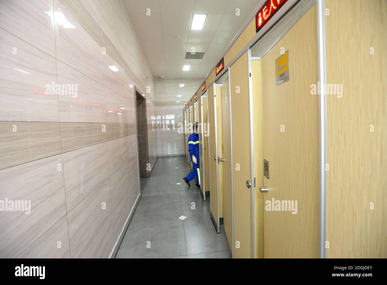 An automatic warning device is installed in a public toilet, if the ...