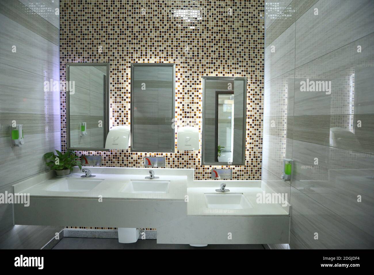An automatic warning device is installed in a public toilet, if the ...