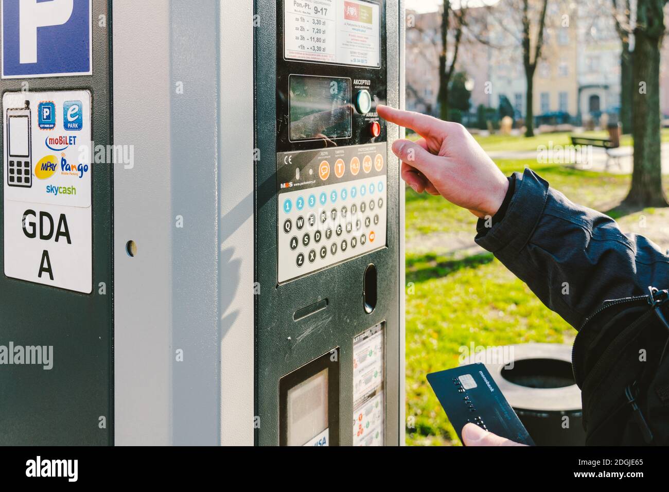 Man pays for parking with a credit card with NFS technology. Easy ...