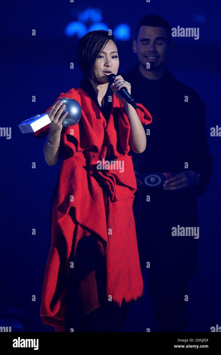Bibi Zhou receives the award for Worldwide Act during the 2014 MTV ...