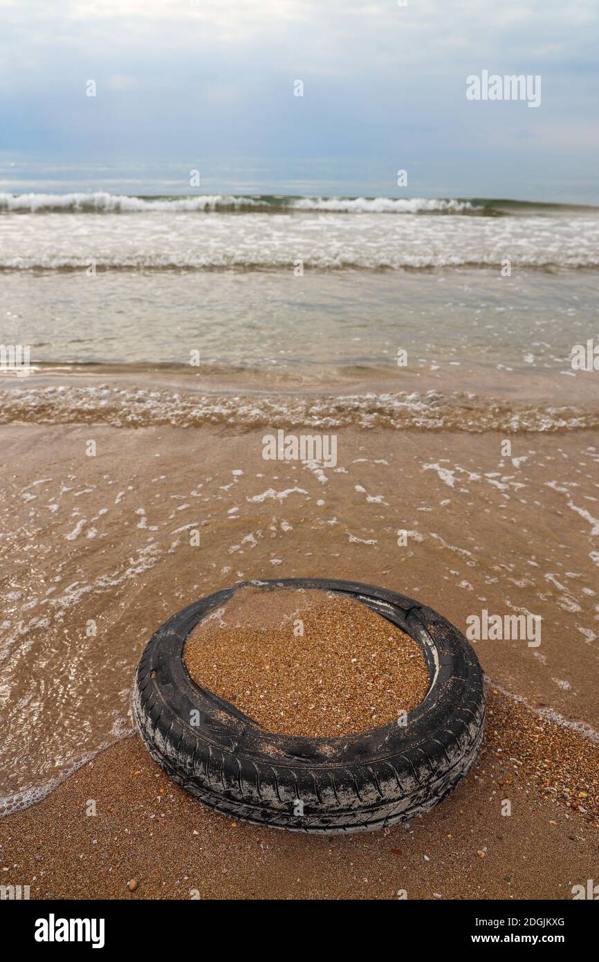 Single Car tire on the beach, Environment, Clouds in the Background ...