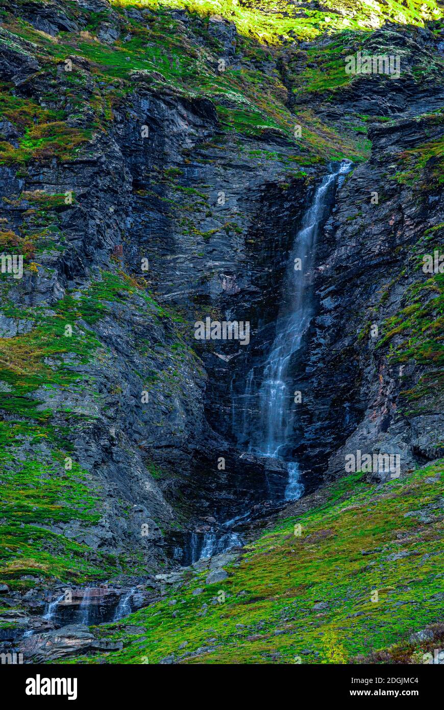 Waterfall free falling from a steep mountain slope Stock Photo - Alamy