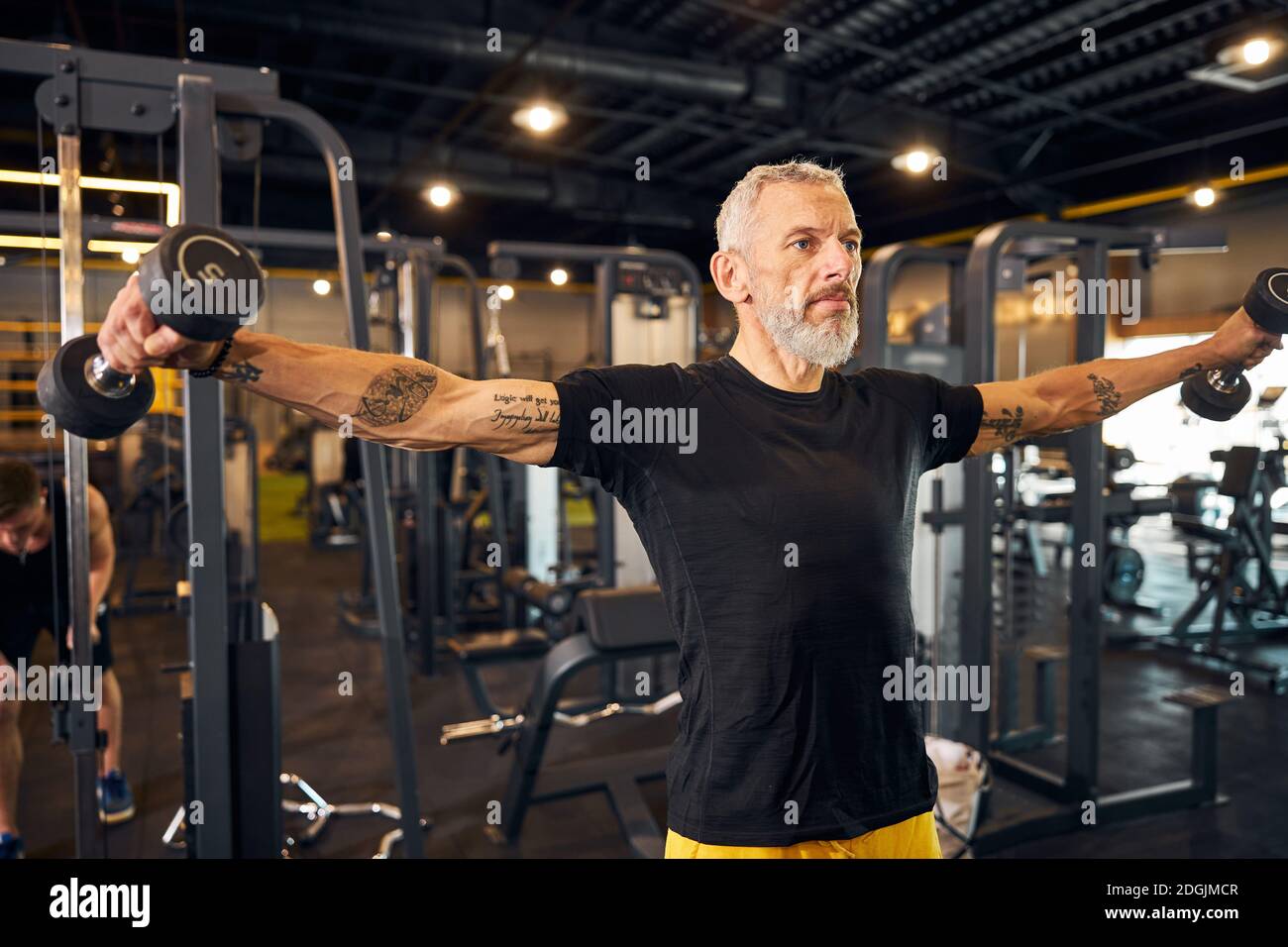 Professional sportsman performing a strength training exercise Stock ...