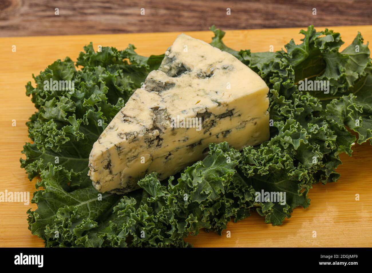 Dairy Blue cheese triangle with mold Stock Photo - Alamy