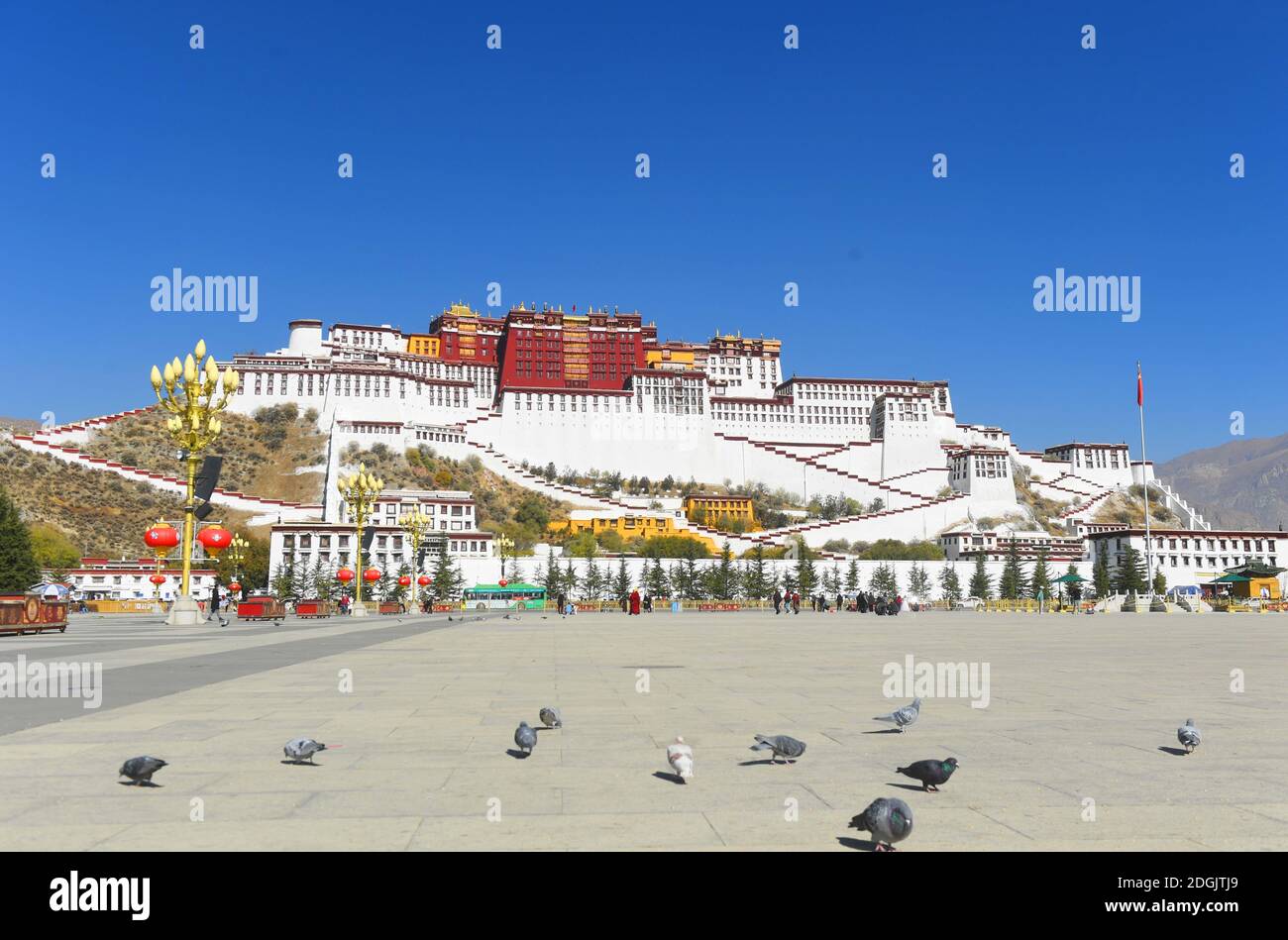 The view of the Potala Palace stands upon a hill in the sunshine in ...