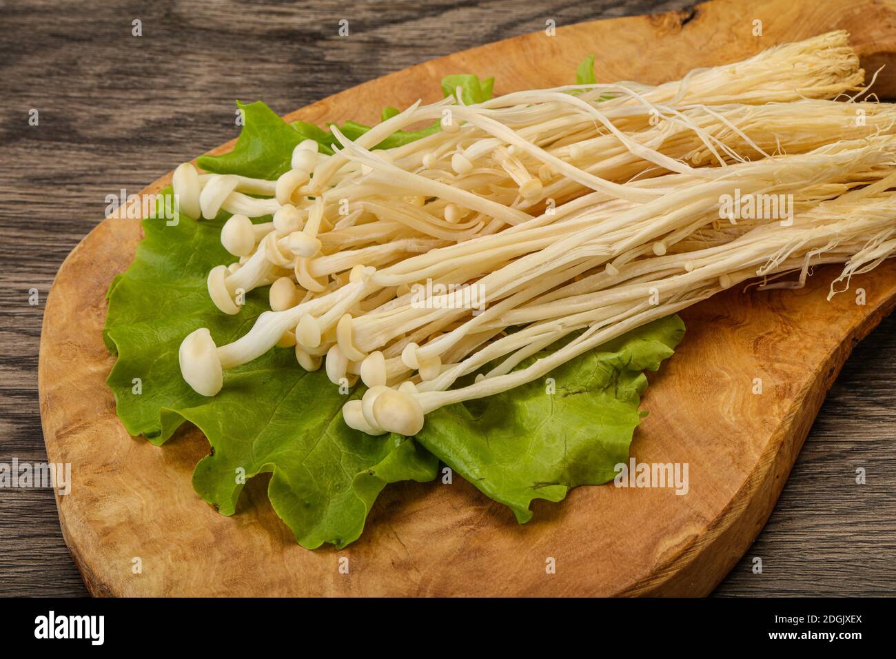 Raw Japanese Enoki mushrooms for cooking Stock Photo - Alamy