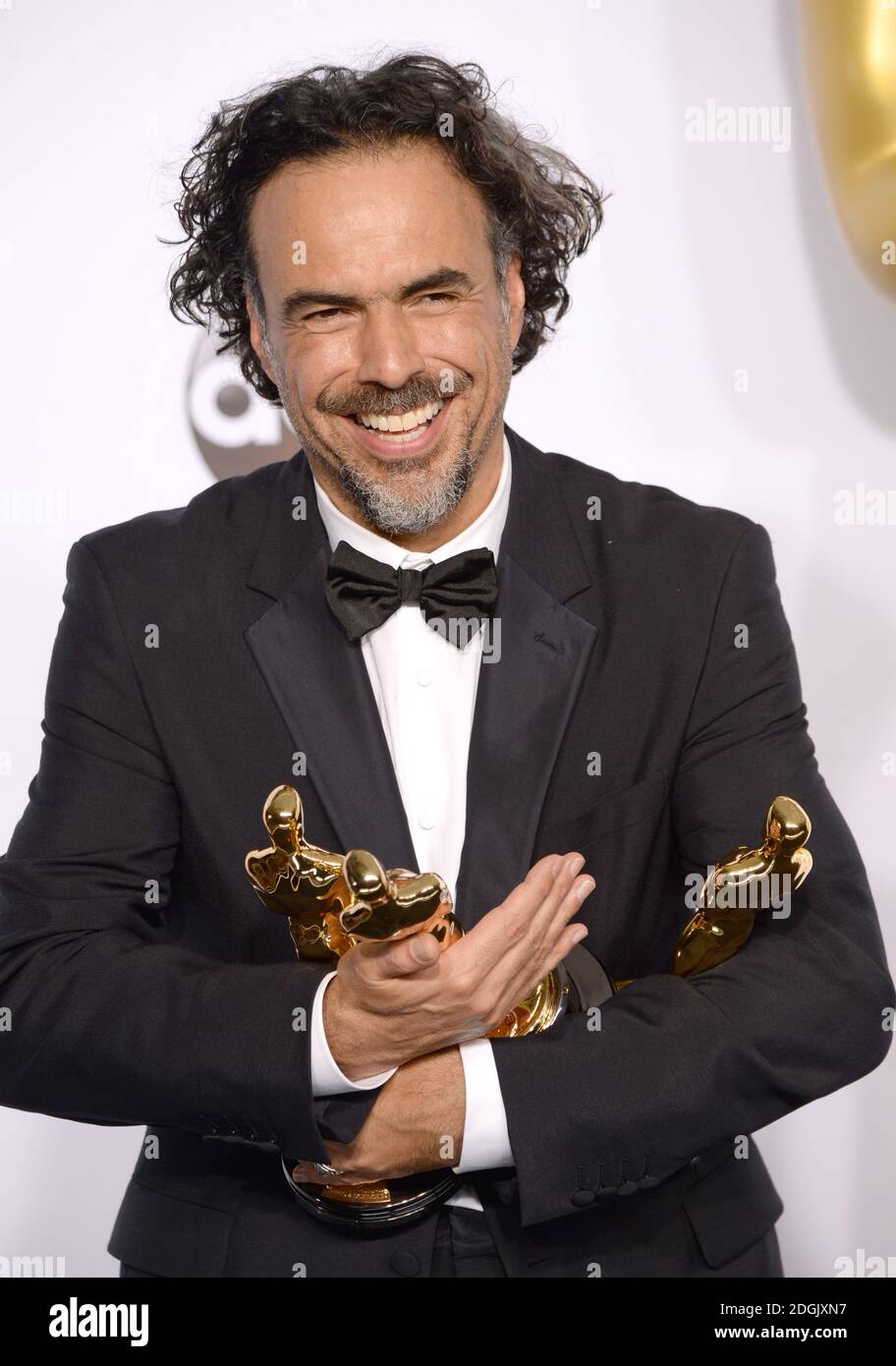 Alejandro G. Inarritu clutches his three Oscar statues for Best ...