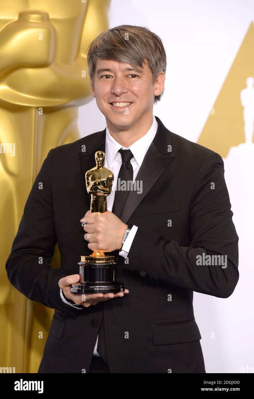 Tom Cross with the Best Editing Award for 'Whiplash', in the press room ...