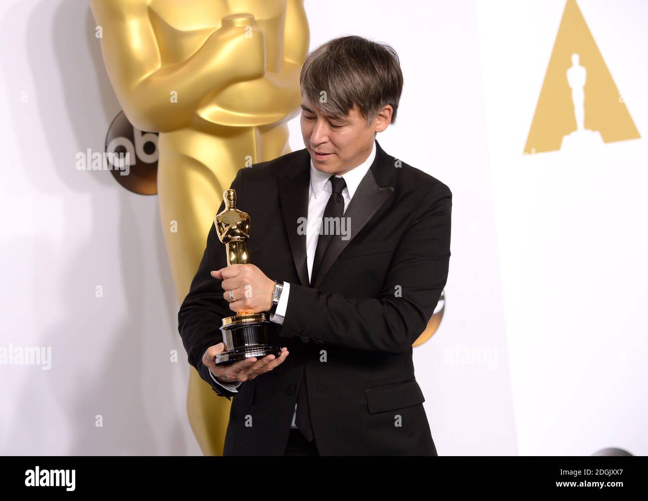 Tom Cross with the Best Editing Award for 'Whiplash', in the press room ...