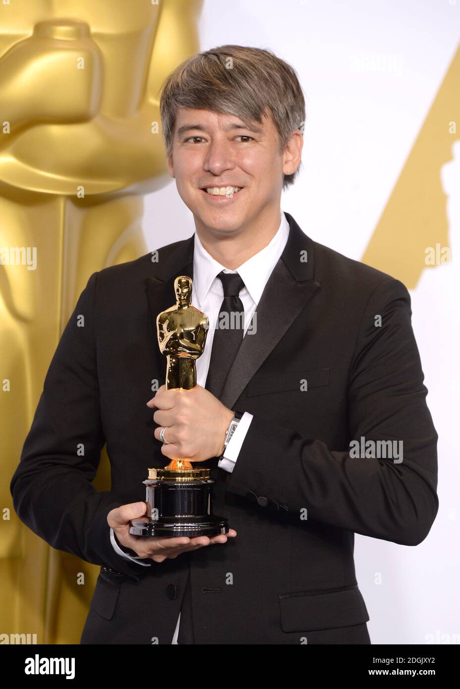 Tom Cross with the Best Editing Award for 'Whiplash', in the press room ...