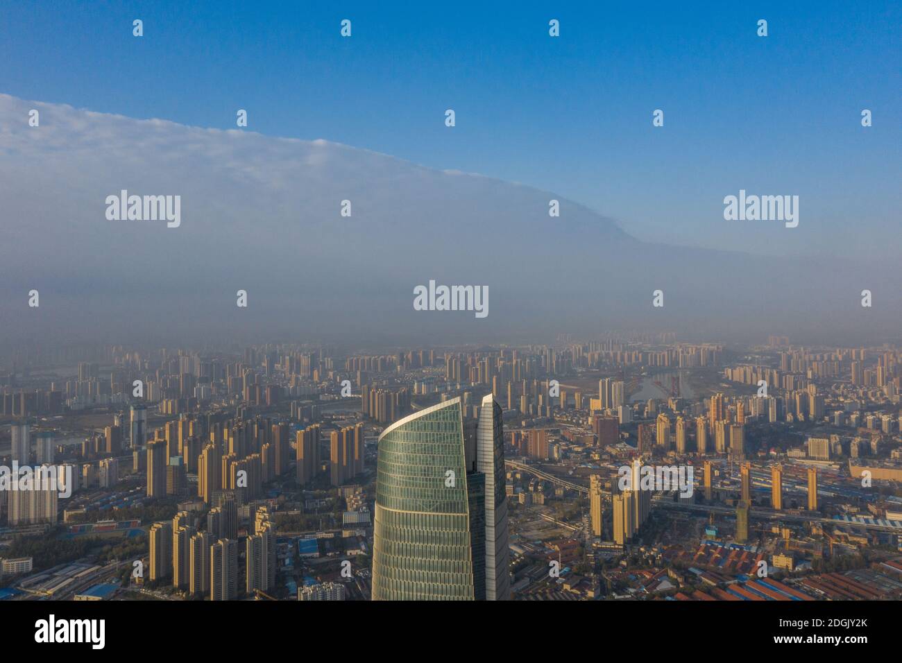 An aerial view of Wuhan Center, a local super tall skyscraper, erecting ...
