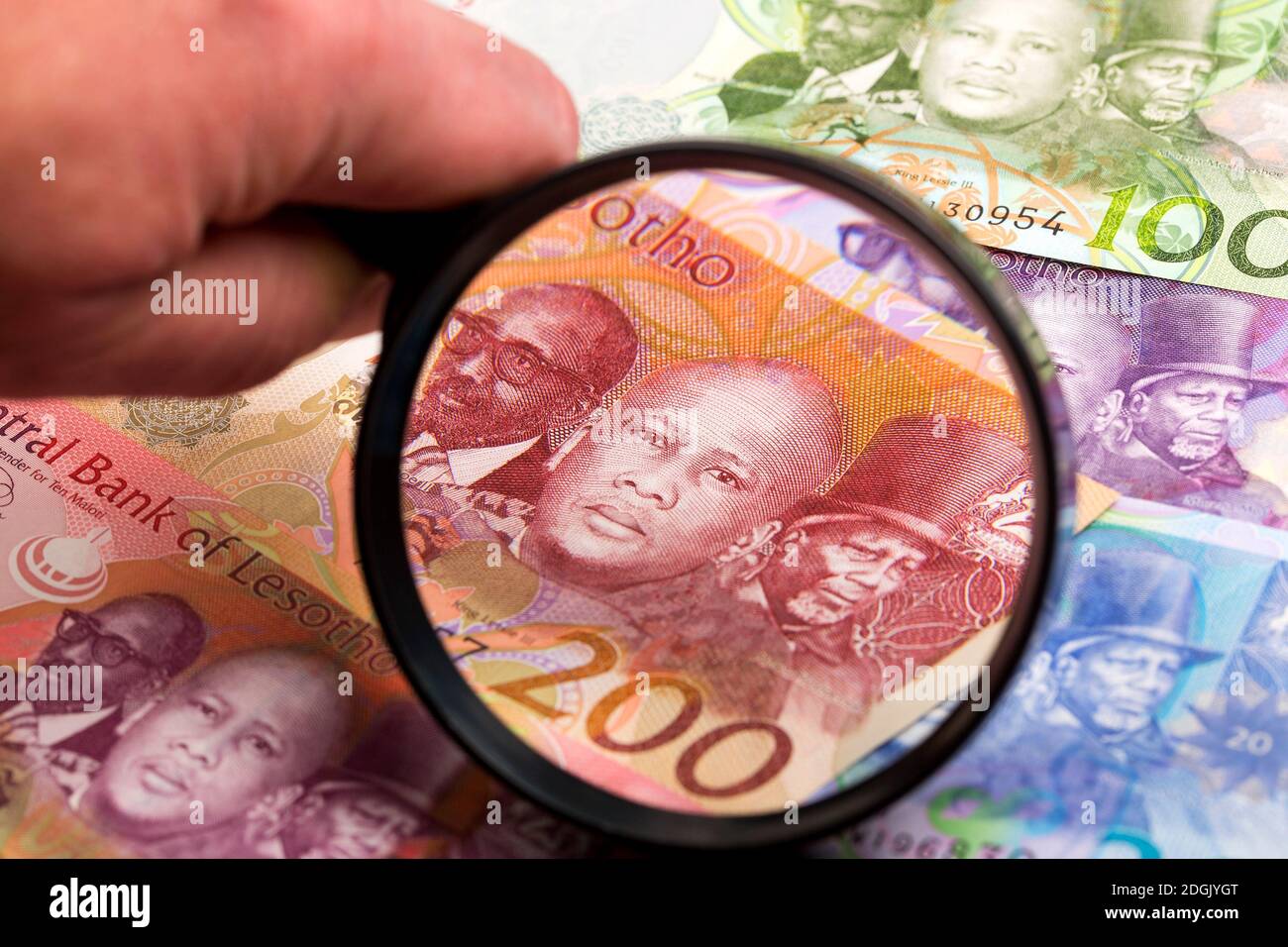 Lesotho money in a magnifying glass Stock Photo - Alamy