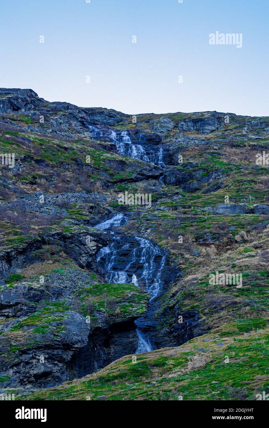 Waterfall free falling from a steep mountain slope Stock Photo - Alamy