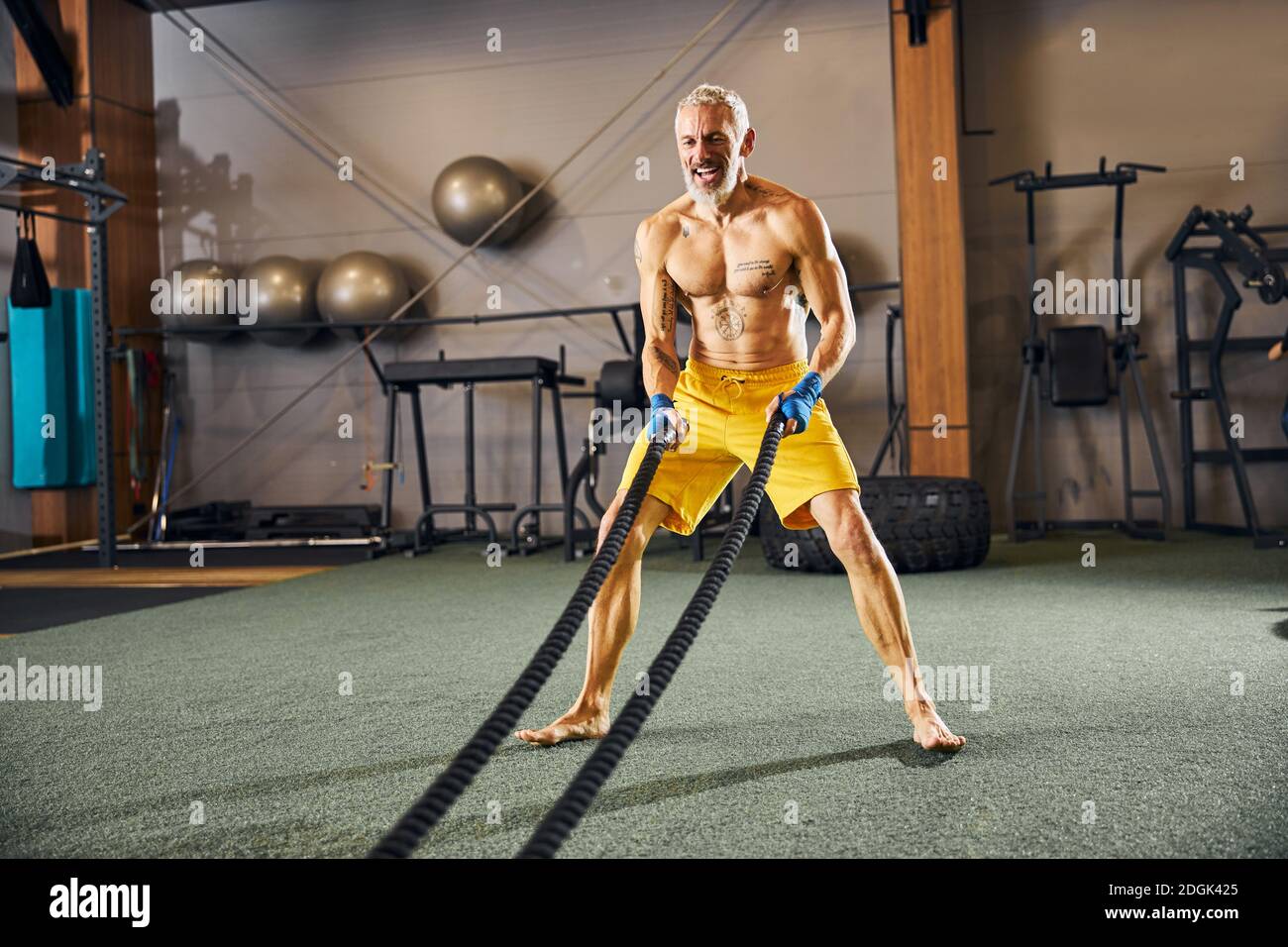 Fitness trainer enjoying his workout at the gym Stock Photo - Alamy