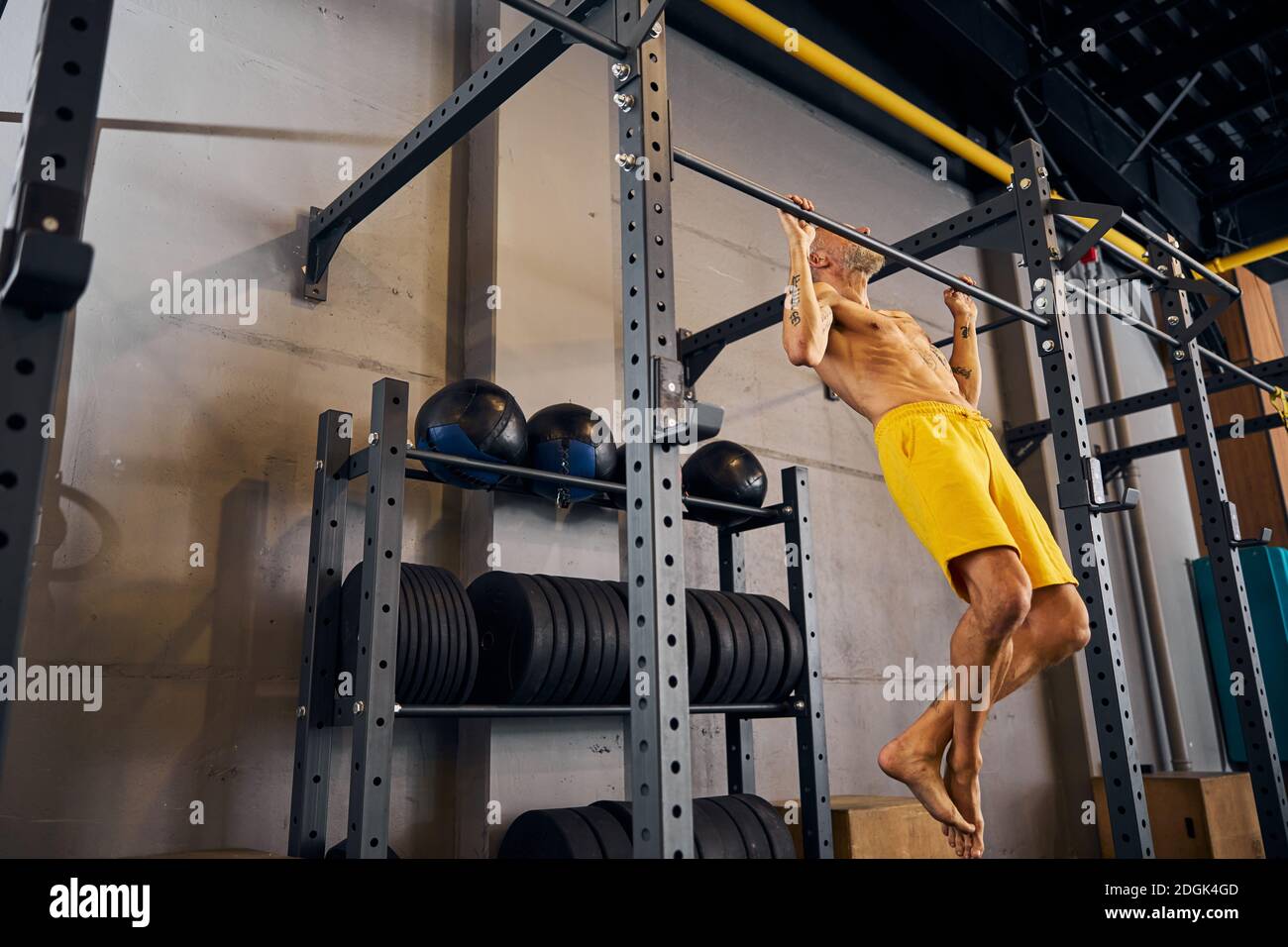 Male athlete performing a strength training exercise Stock Photo - Alamy