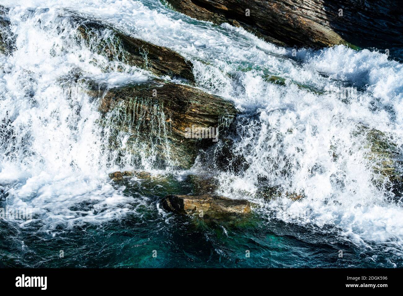 Wild and fast moving river rapids white water rushing over rugged ...