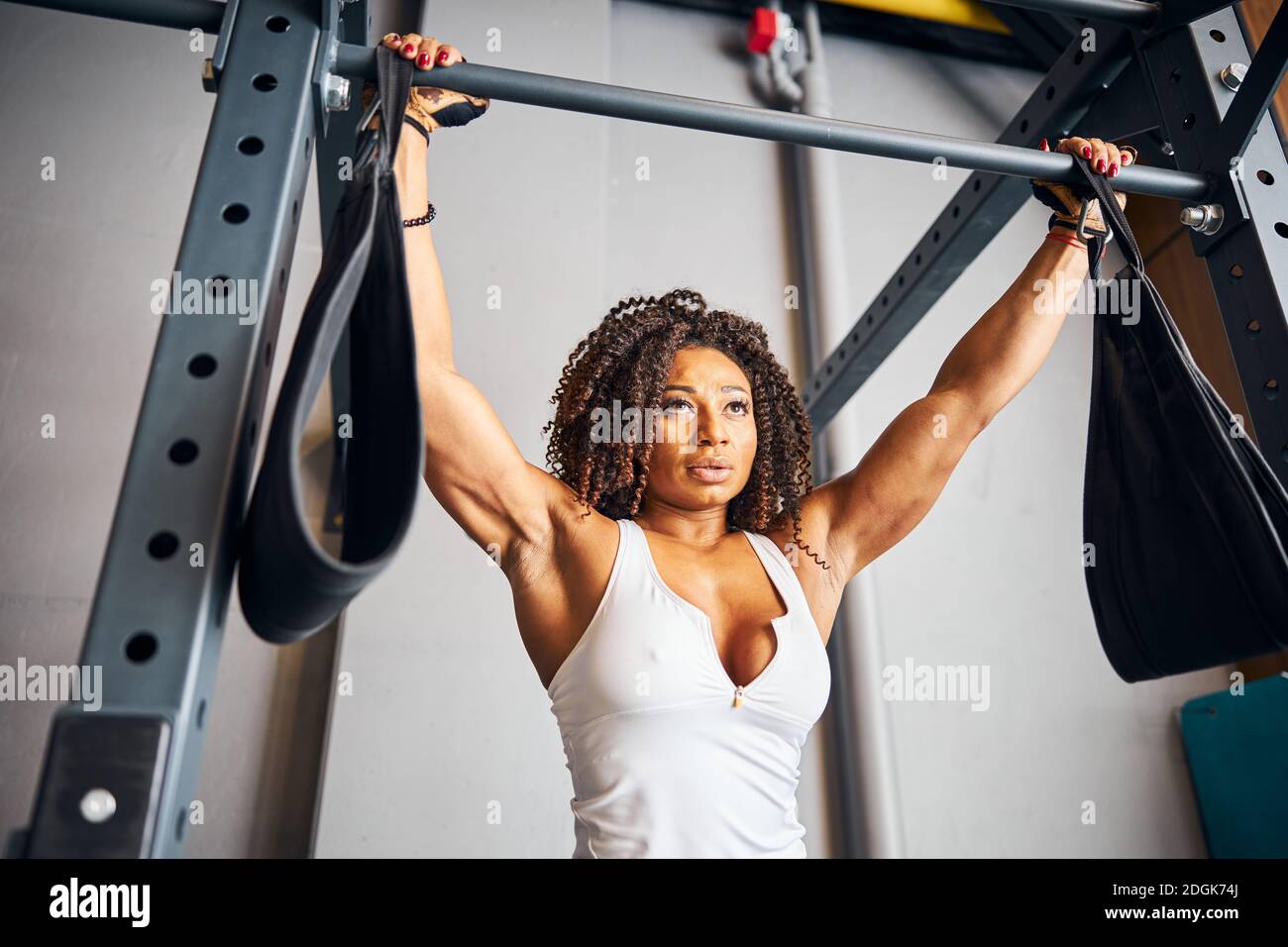 Focused woman gymnast preparing for the strength training workout Stock ...