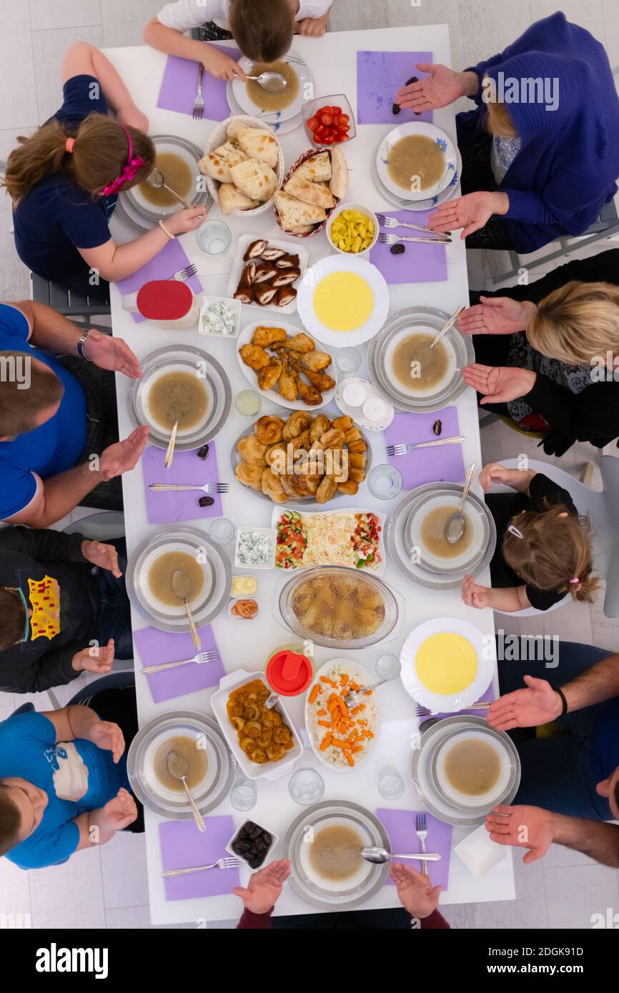 Iftar dinner muslim family together during a ramadan feast at home top ...