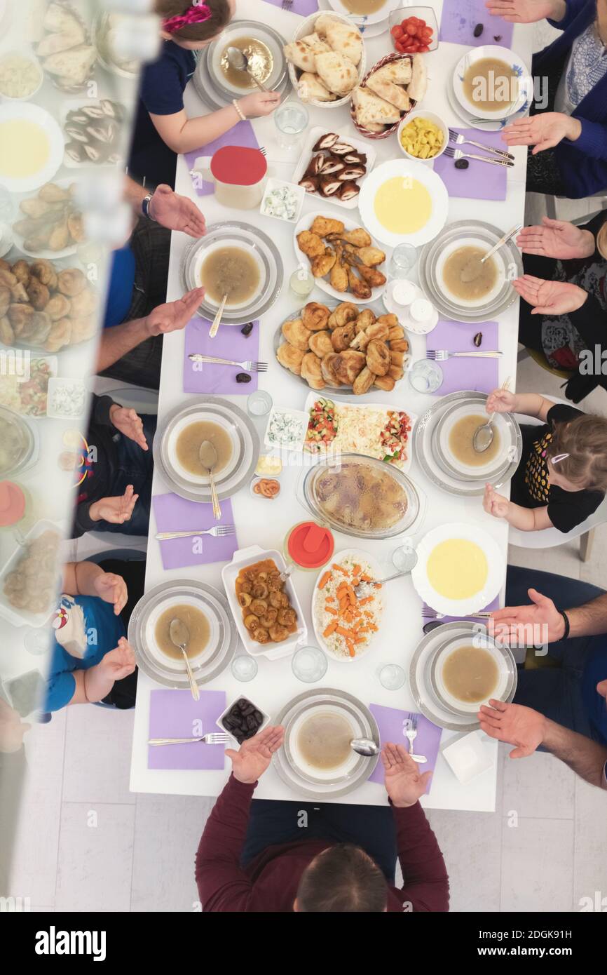 Iftar dinner muslim family together during a ramadan feast at home top ...