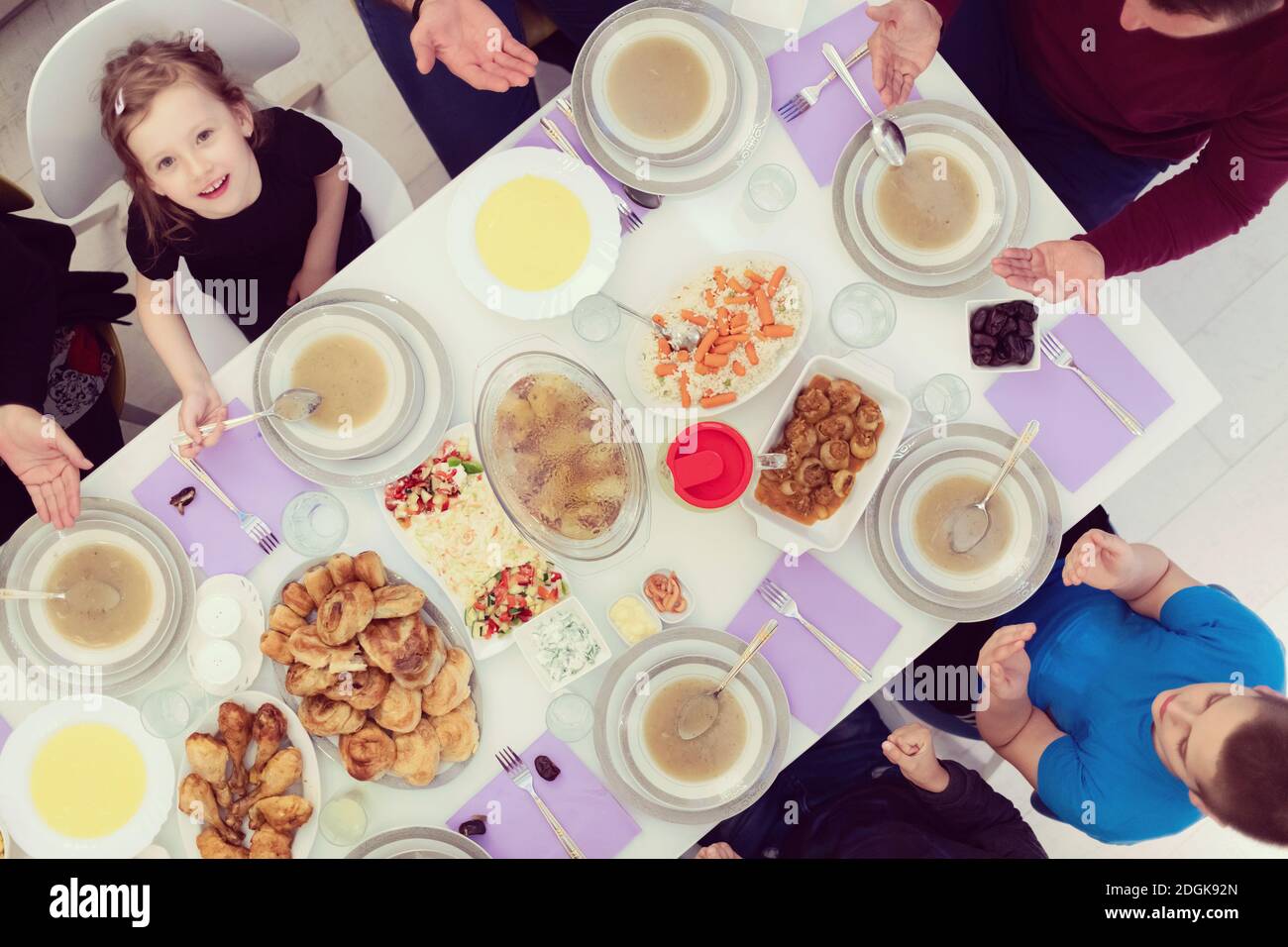 Iftar dinner muslim family together during a ramadan feast at home top ...