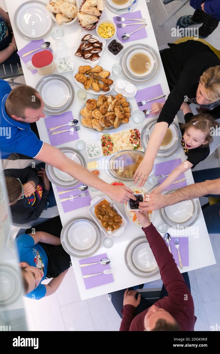 Iftar dinner muslim family together during a ramadan feast at home top ...