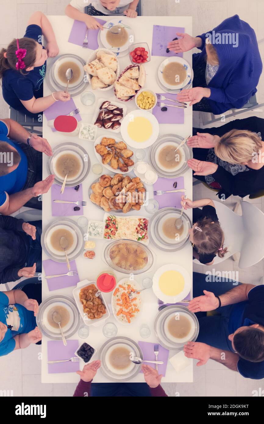 Iftar dinner muslim family together during a ramadan feast at home top ...