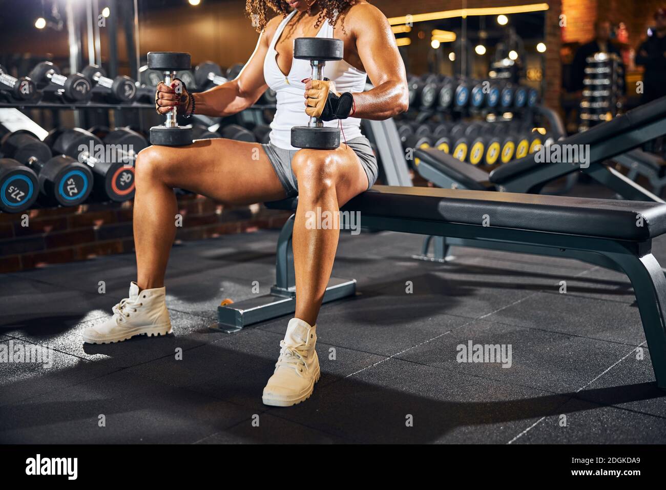 African American bodybuilder doing a seated dumbbell exercise Stock ...