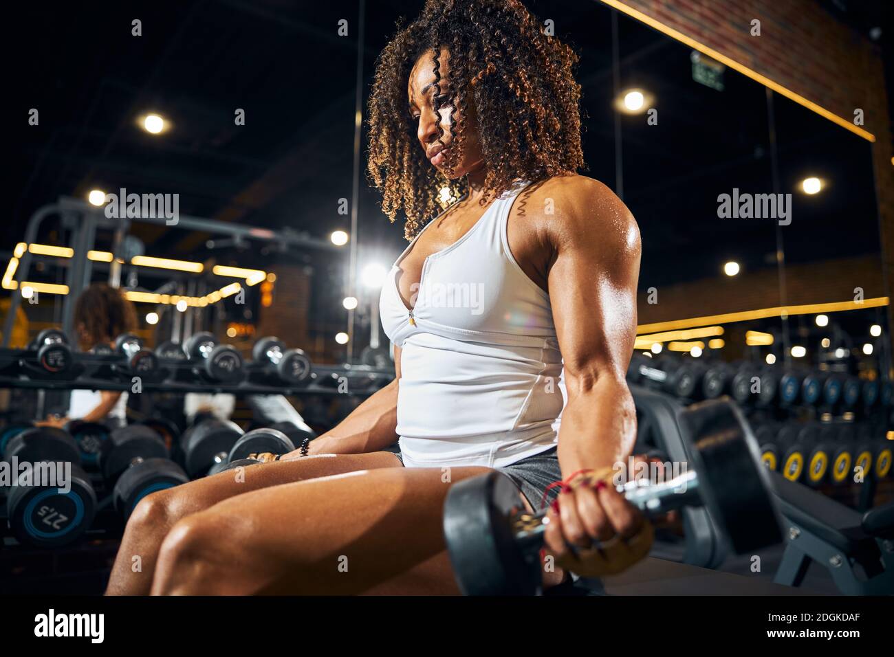 Professional woman bodybuilder working out with dumbbells Stock Photo ...