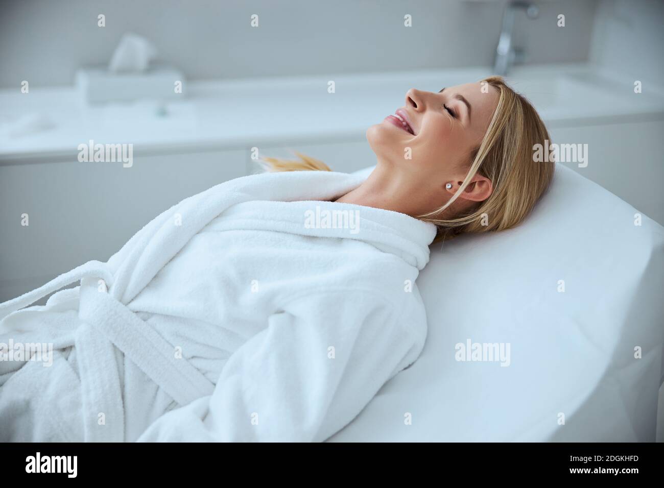 Cheerful client waiting for a spa procedure Stock Photo - Alamy