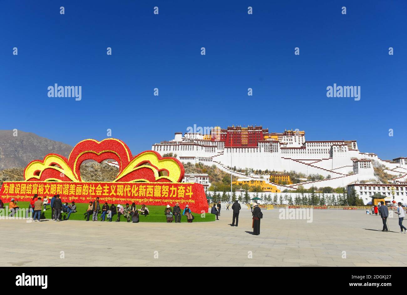 The view of the Potala Palace stands upon a hill in the sunshine in ...