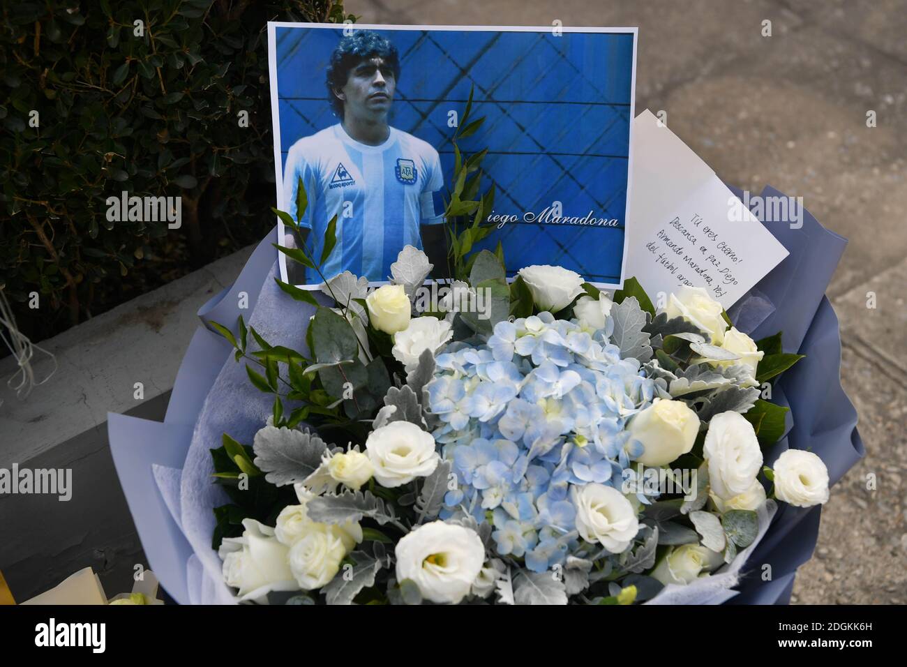 A football fan pays tribute to the memorial stall for late Argentine ...